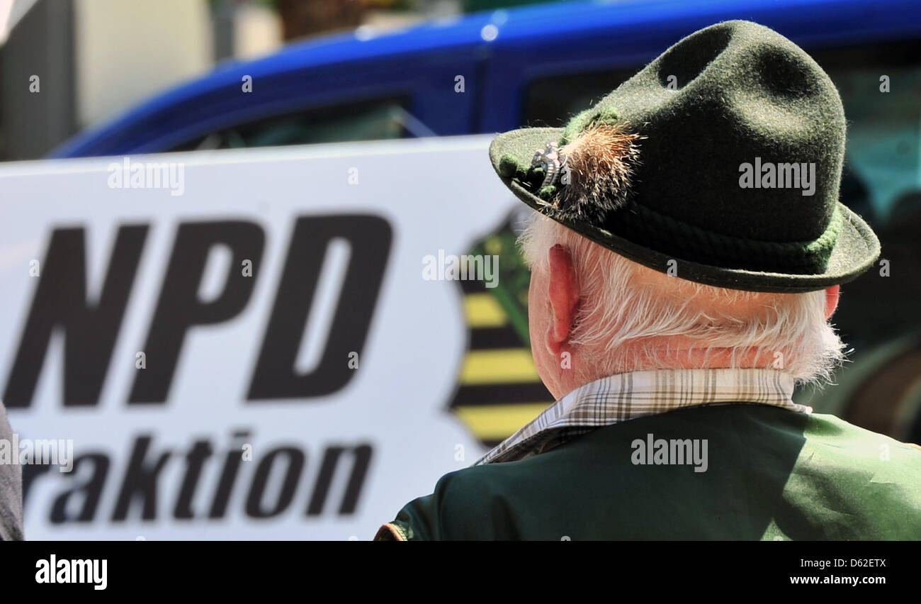 A poster of the far-right German nationalist party NPD is set up during ...
