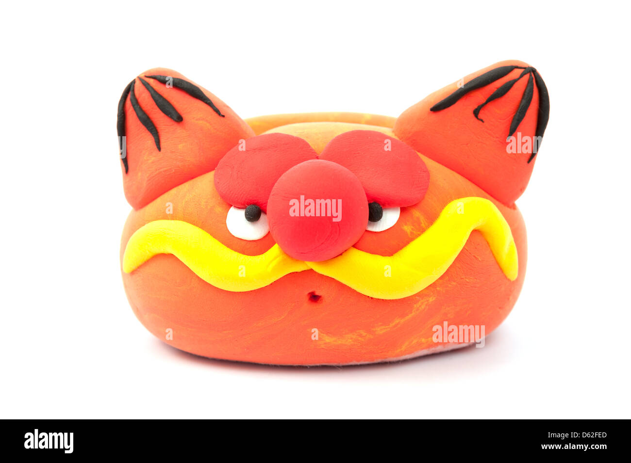 Painted pottery cat on white background Stock Photo - Alamy