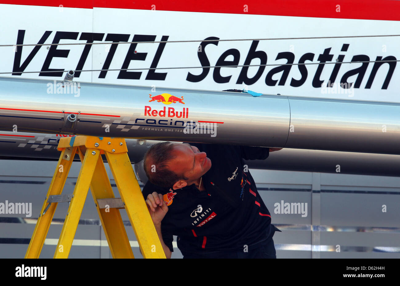 A mechanic from the Red Bull team prepared the garage of German Formula ...