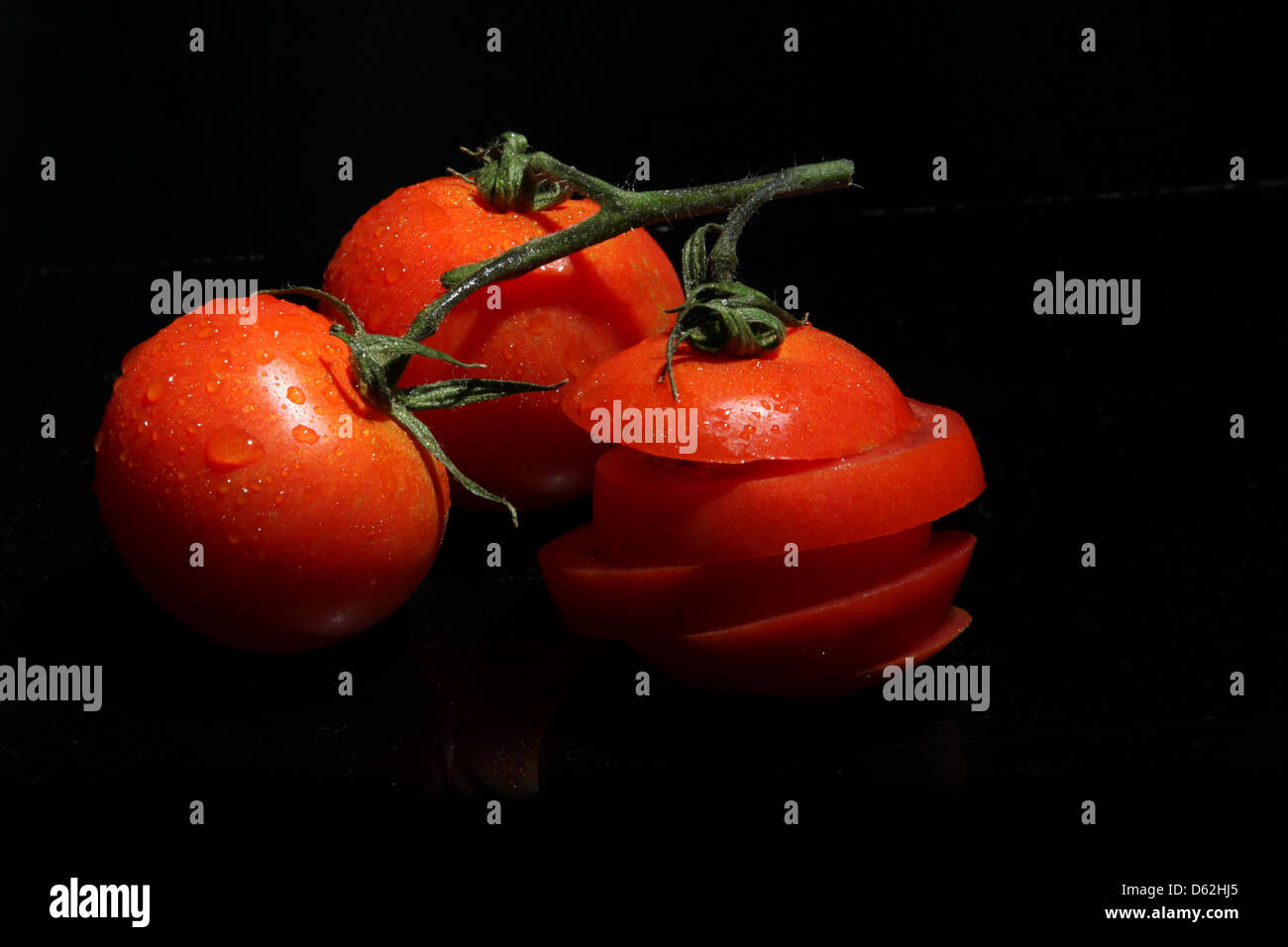 red, tomatoes, black, background, cut, sliced, watery Stock Photo - Alamy