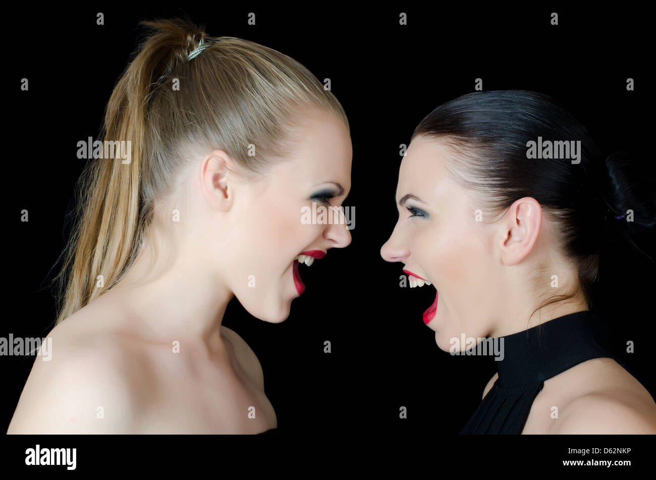 Two beautiful girls shout and swear Stock Photo - Alamy