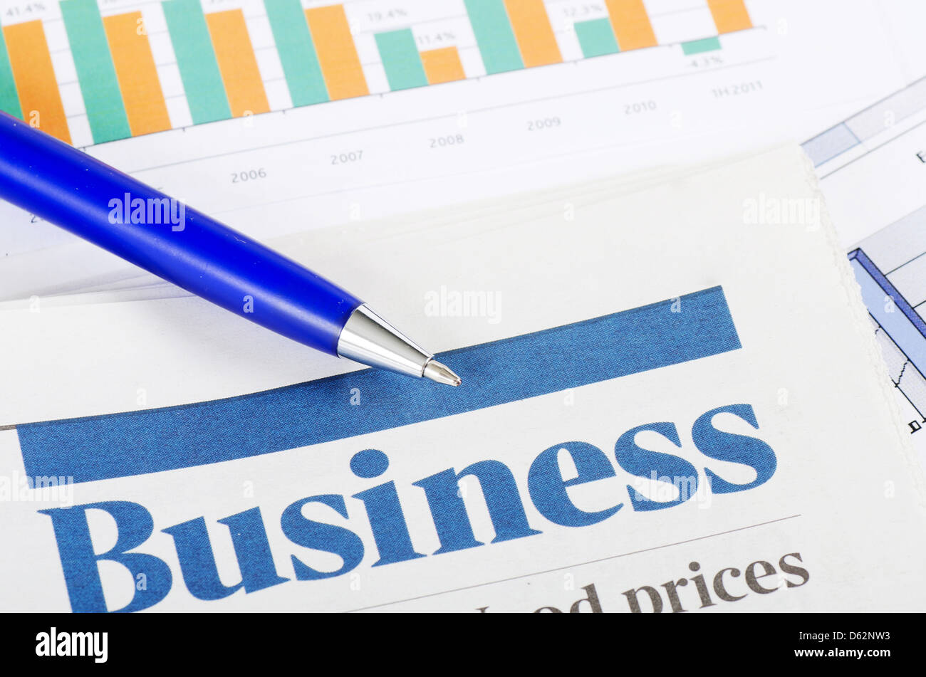 Business the newspaper with chart Stock Photo - Alamy