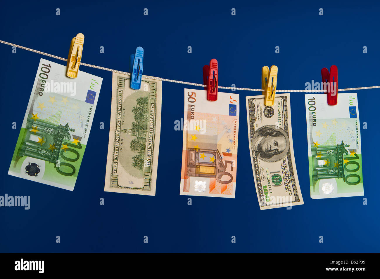 Drying of money after washing up Stock Photo - Alamy