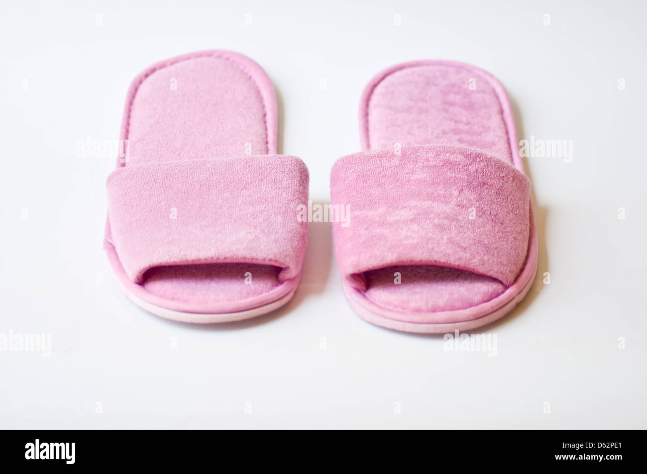 violet slipper on white background for use in house Stock Photo - Alamy