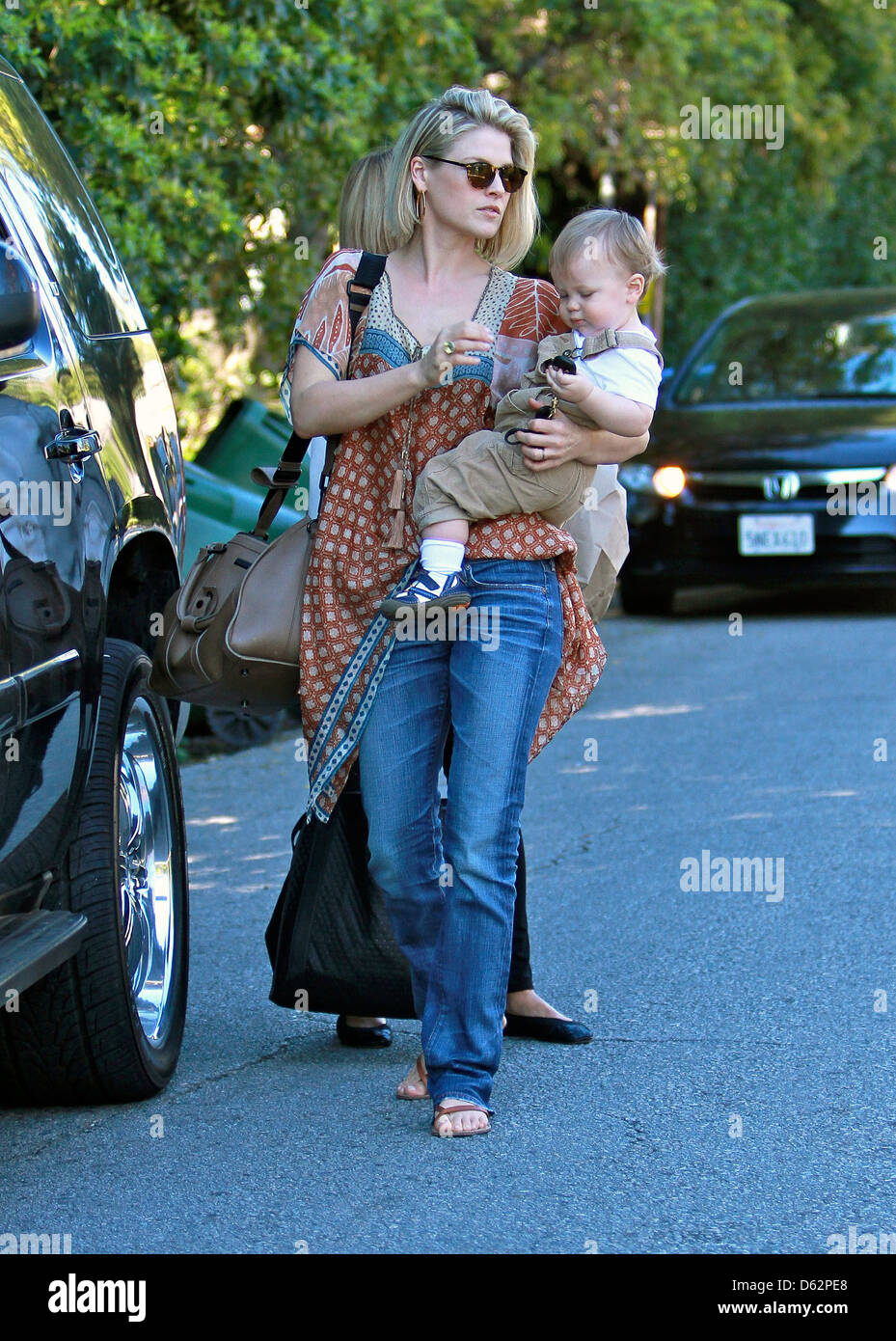 Ali Larter carries her son Theodore Hayes MacArthur to visit a friend ...