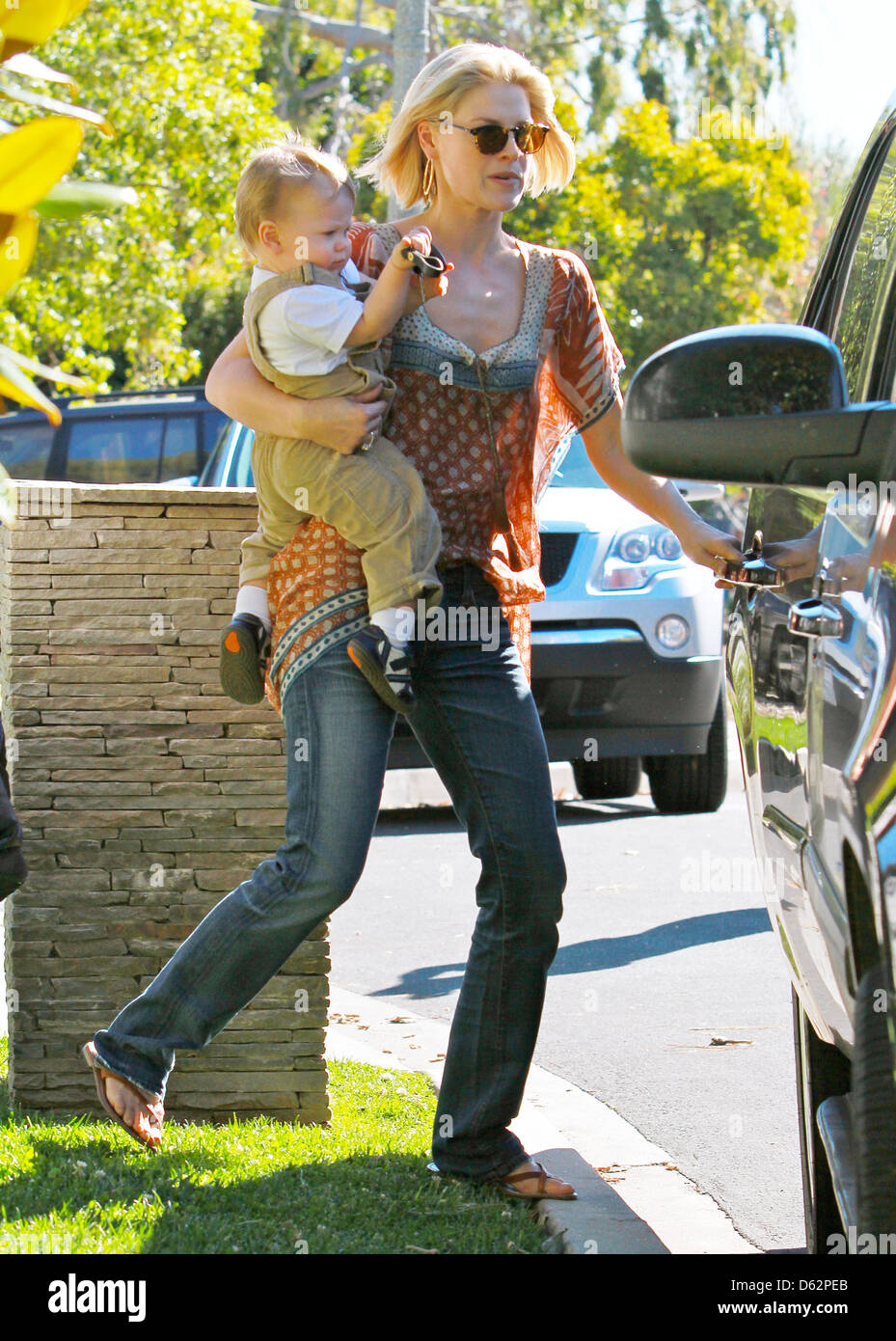 Ali Larter carries her son Theodore Hayes MacArthur to visit a friend ...