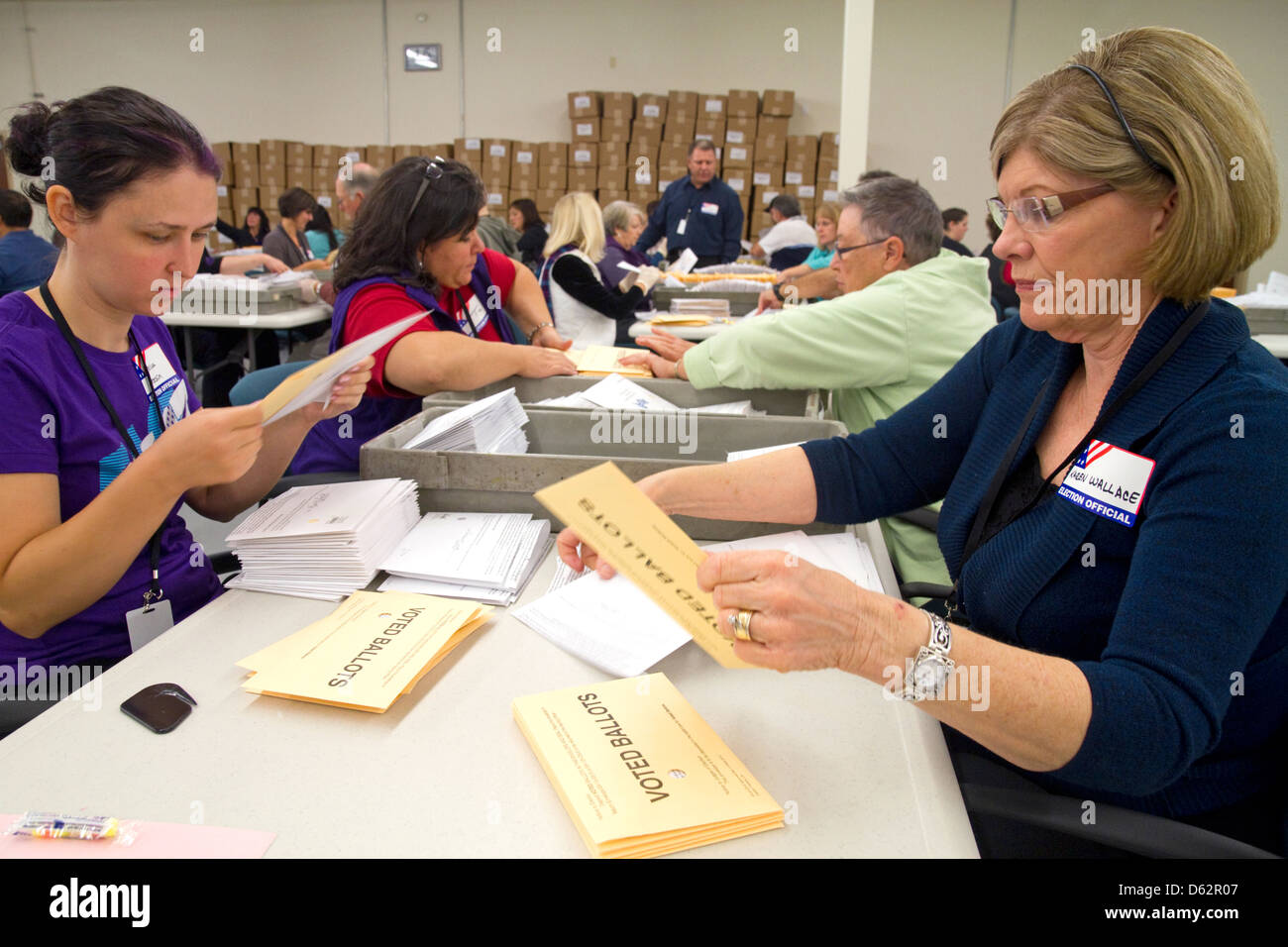 Absentee ballots being sorted and prepared for recording at the Ada ...
