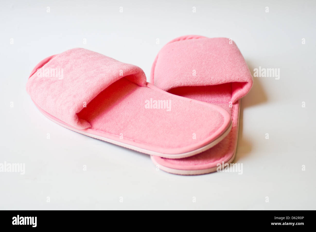 pink slipper on white background Stock Photo - Alamy