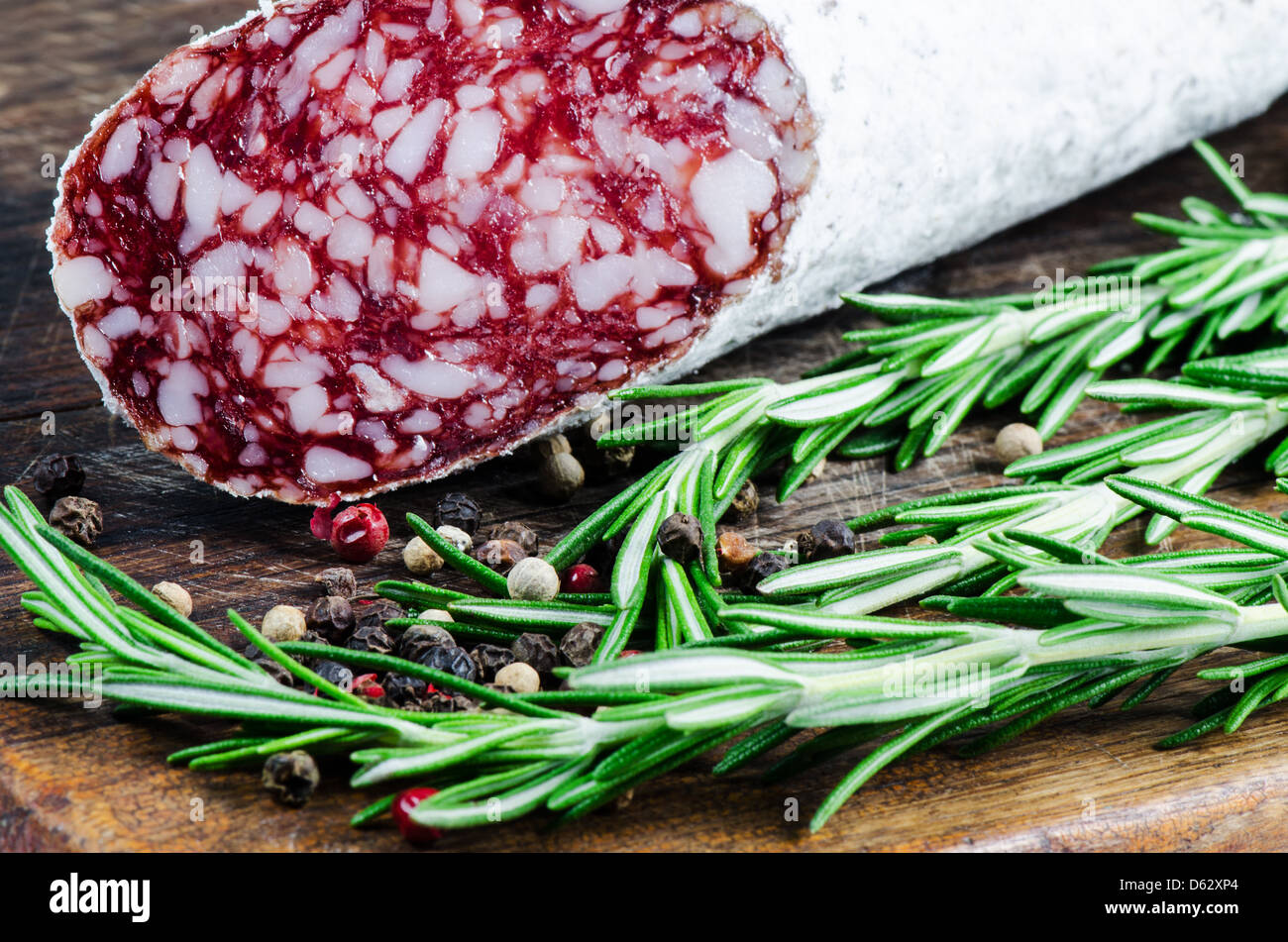 Salami and peper corns with rosemary Stock Photo - Alamy