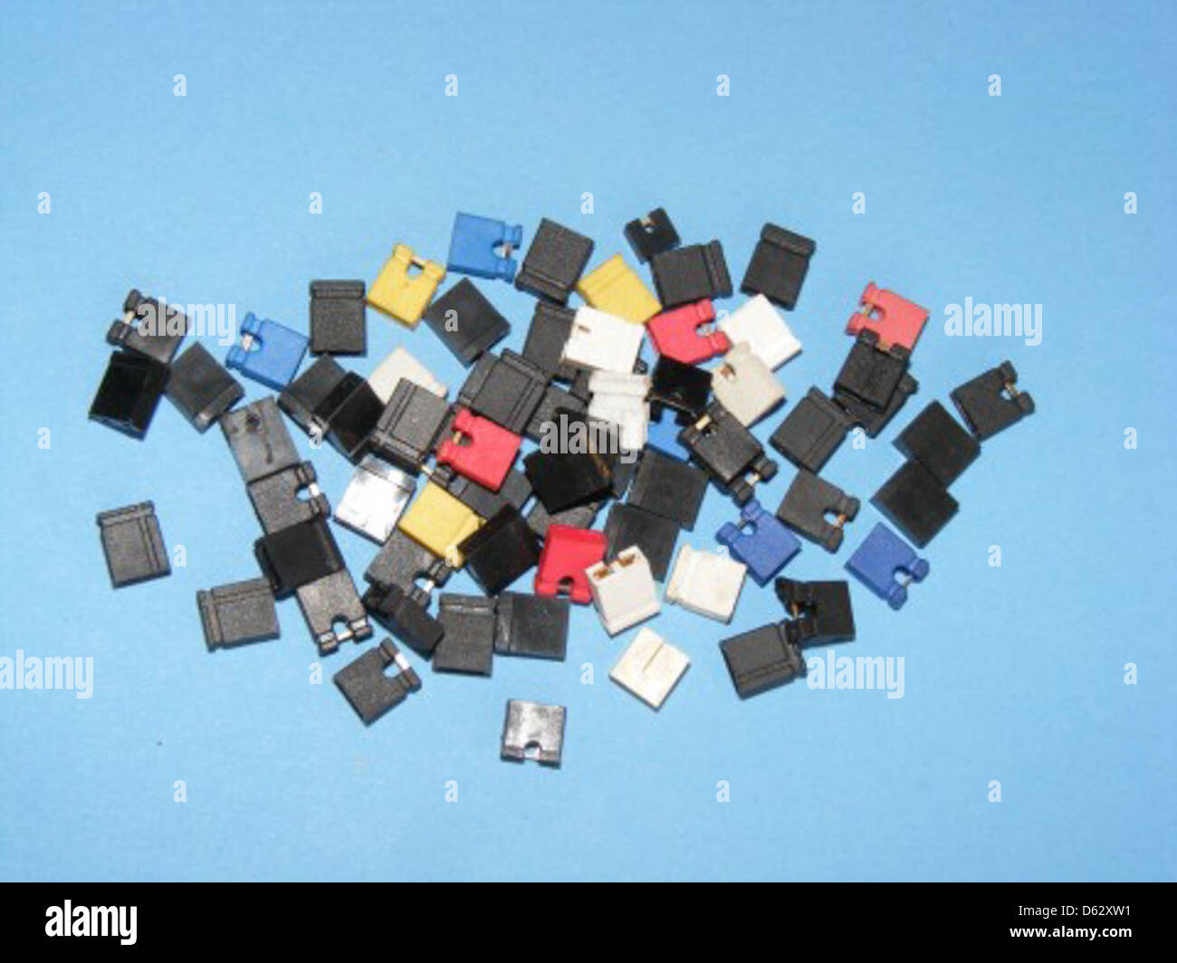 This image shows a 2-pin jumper used in electronics for shorting or ...