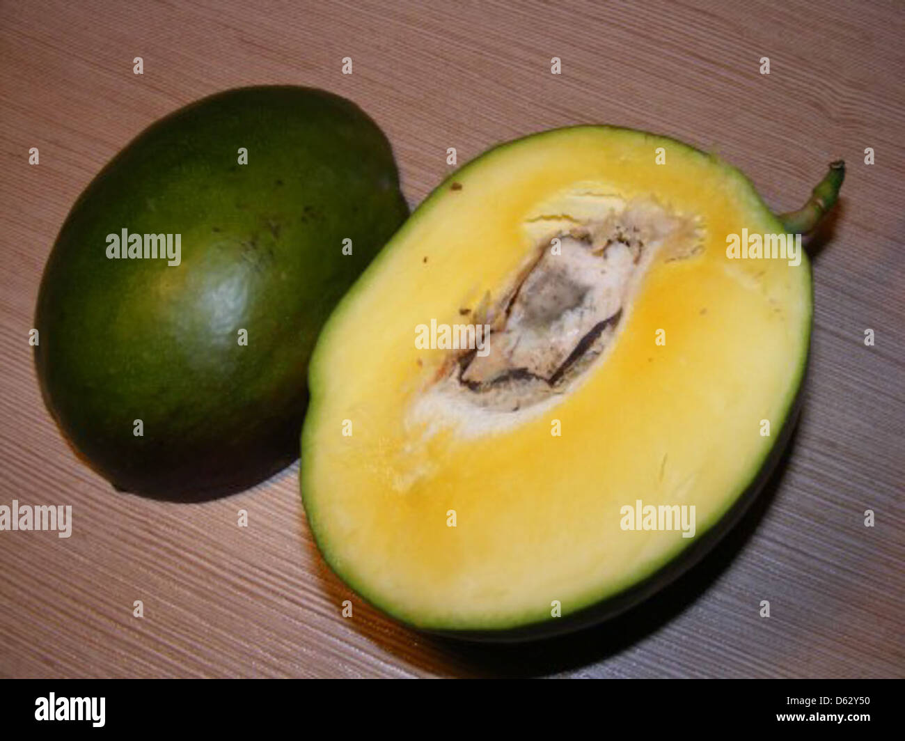 A close-up photo of a ripe mango, showcasing its vibrant color and ...