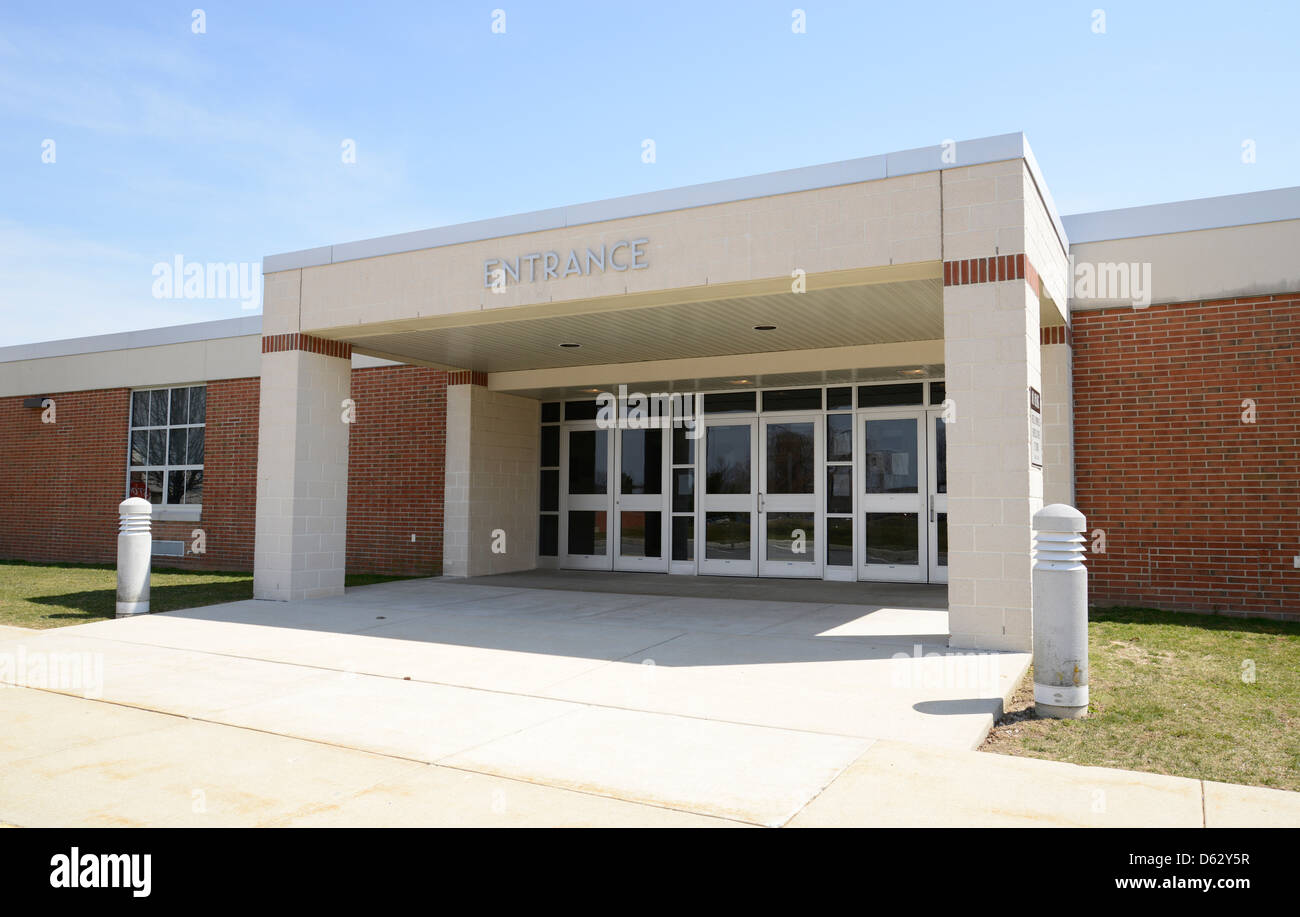 entrance for a modern school, with a covered entryway and sidewalk ...