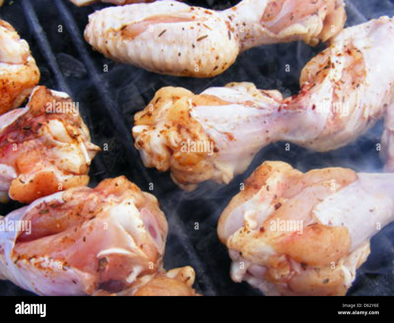 A selection of grilled foods, including chicken wings, grilled fish ...
