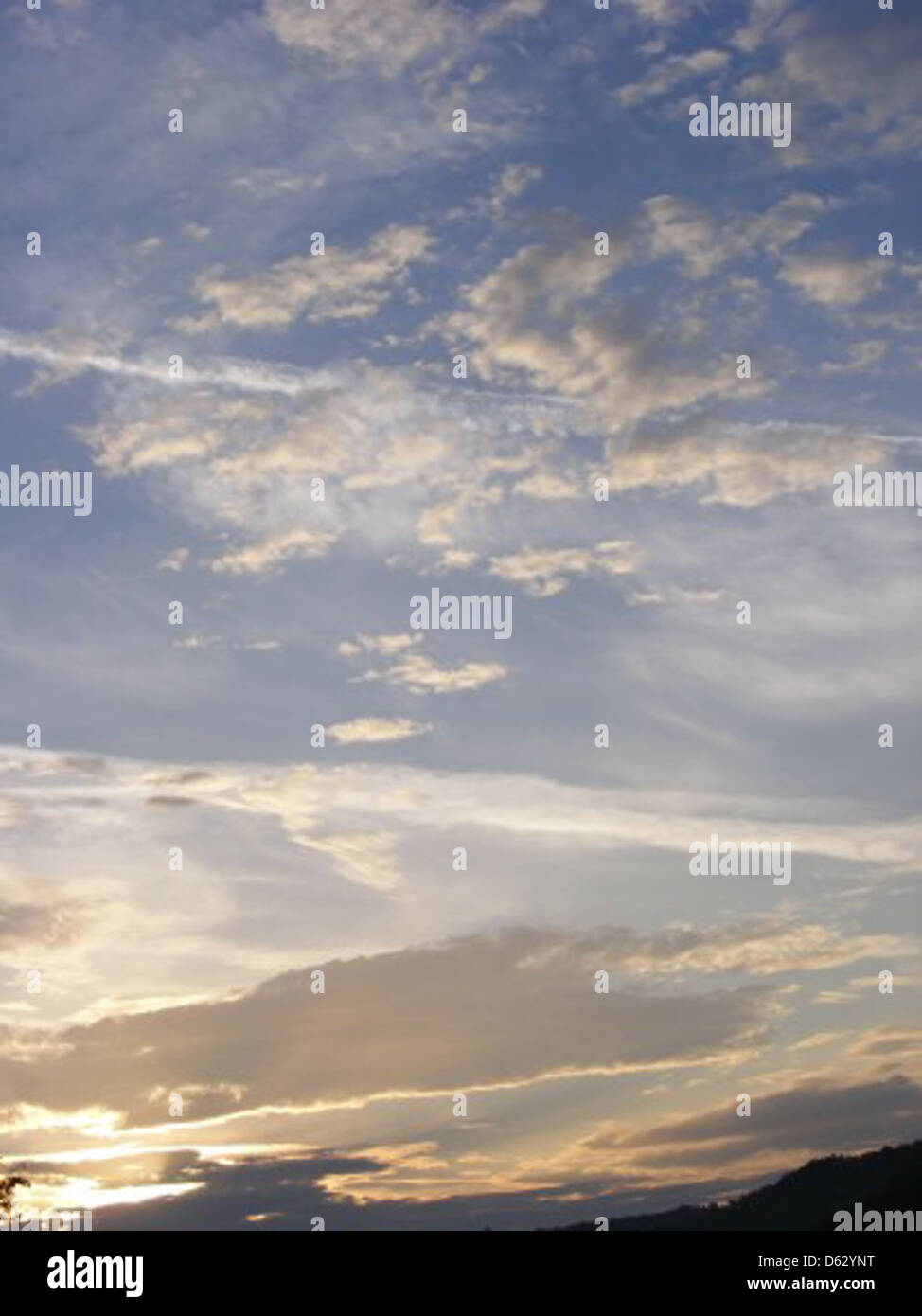 A stunning photograph of a sunrise sky, with clouds illuminated by the ...