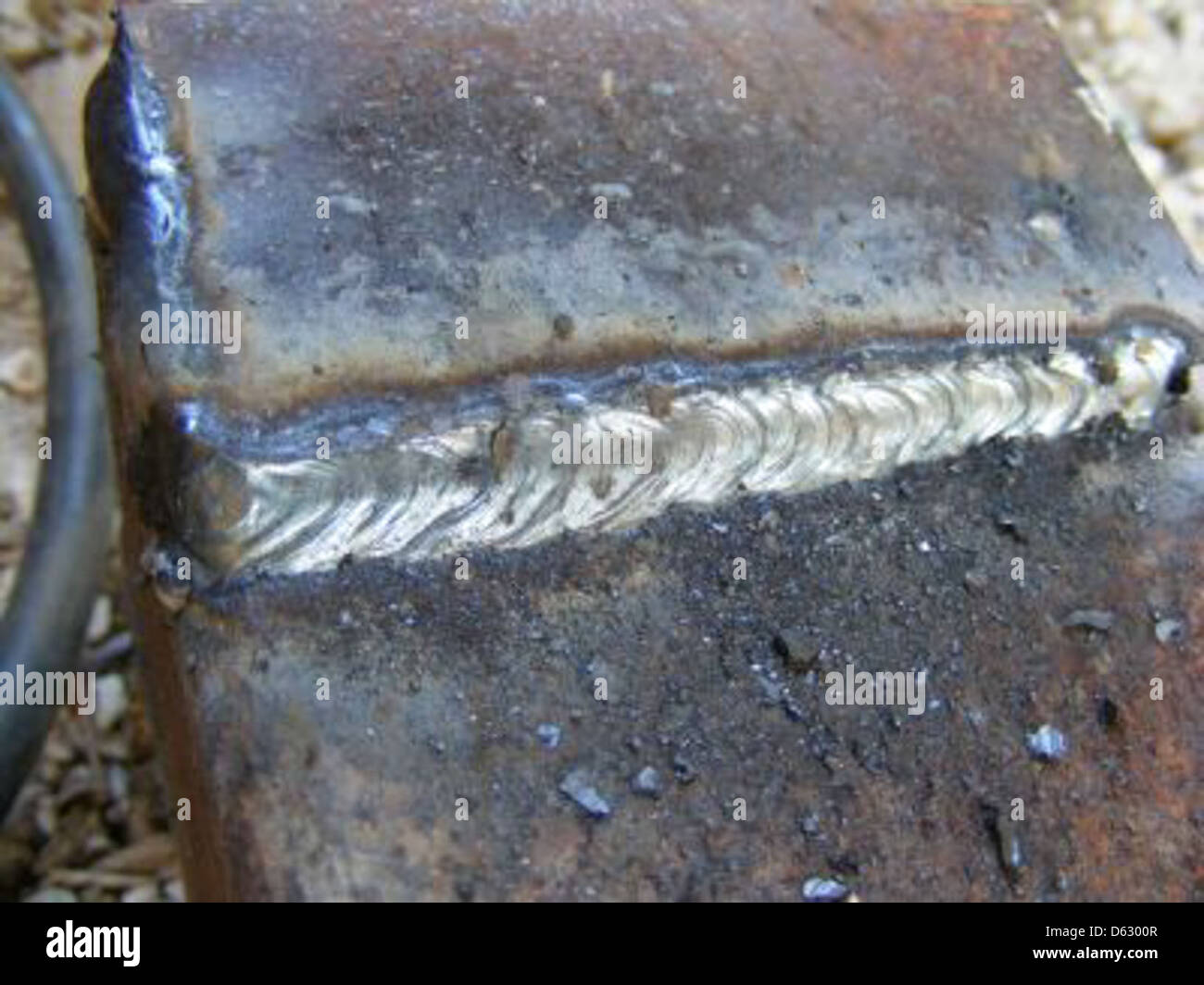 A close-up of a Manual Metal Arc Welding (MMAW) process, showing the UV ...