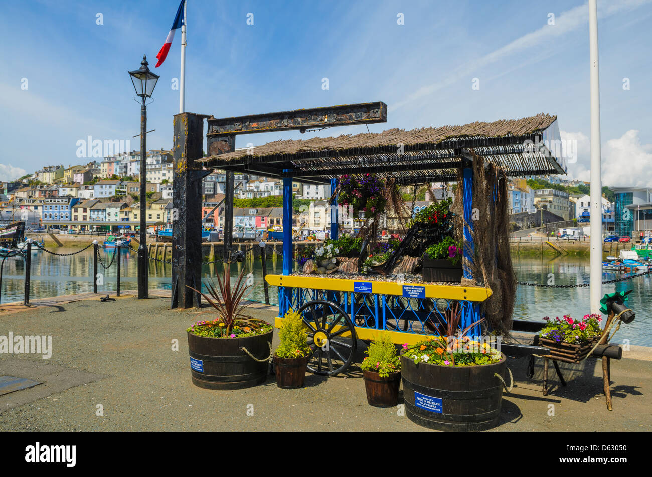 Flower display on the quayside in the fishing town of Brixham, Devon ...