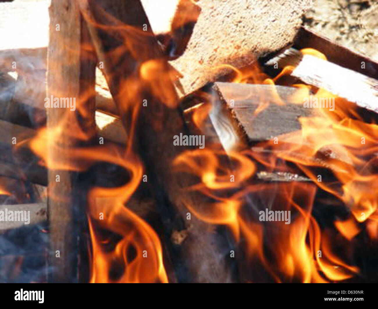 An image showing hot coal in a public domain photo. The coal is red and ...