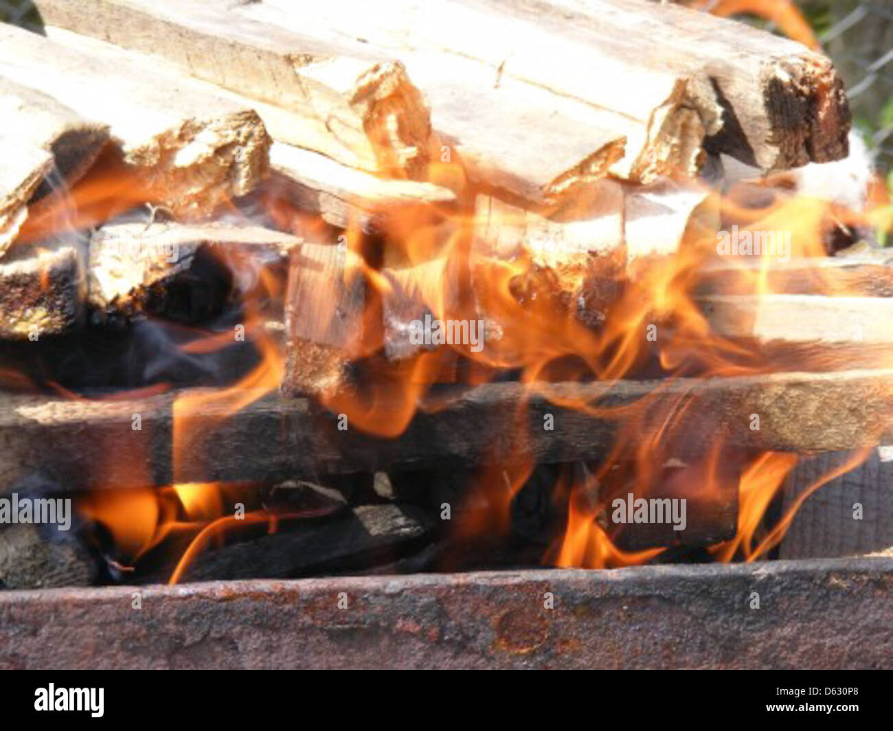 A hot coal barbeque fire with glowing embers, ready for grilling. The ...