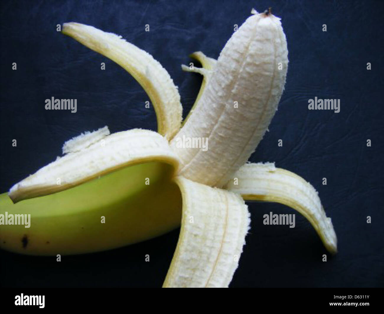 A peeled banana, showing the fruit's smooth and soft interior. Bananas ...