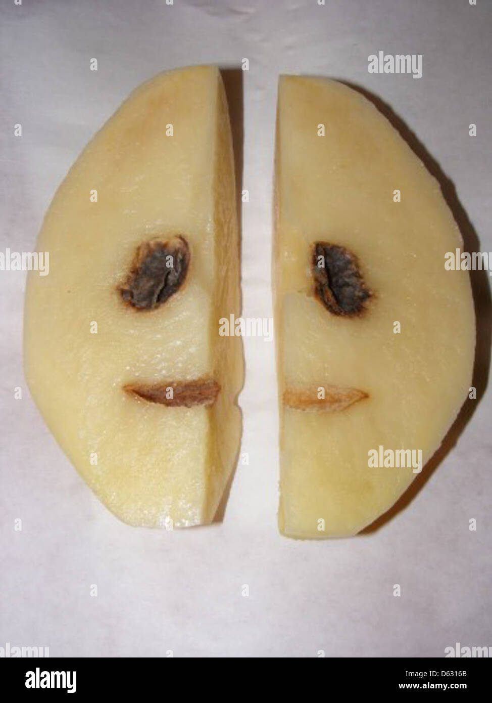 A playful photo of potatoes with a quirky 'smile' shaped indentation ...
