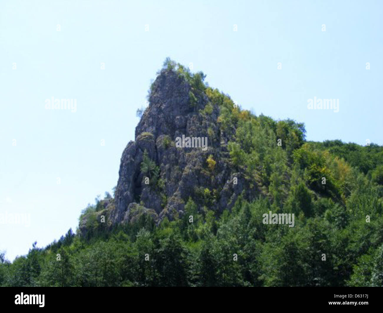 A panoramic view of Baia de Fier, a mountain region in Romania. The ...