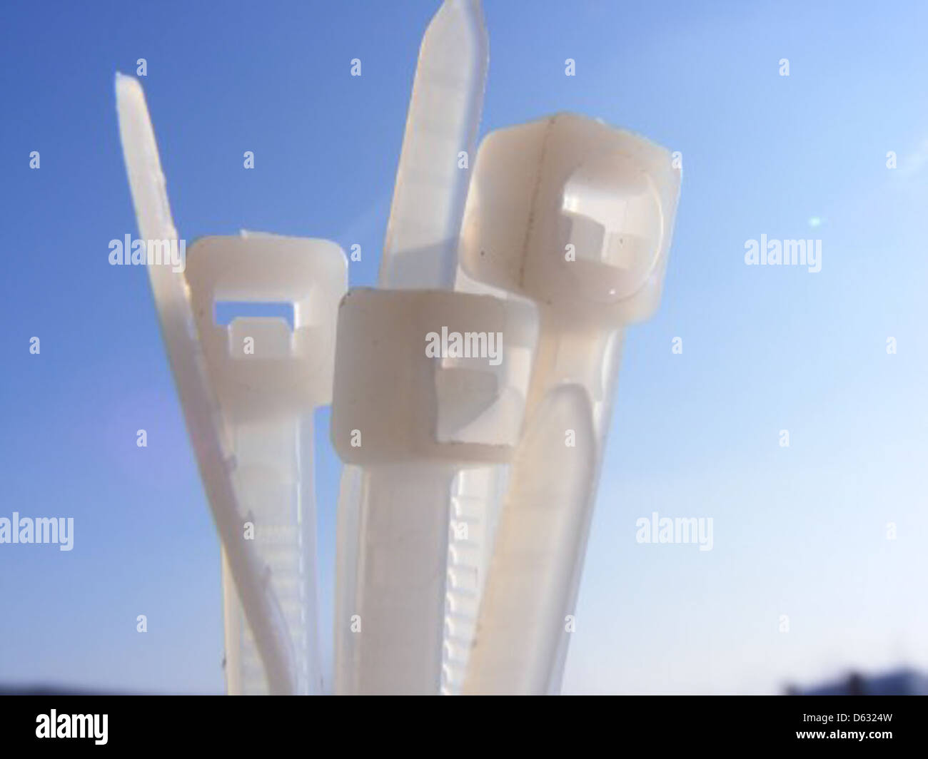 Nylon cable tie designed to self-lock for secure fastening of cables ...