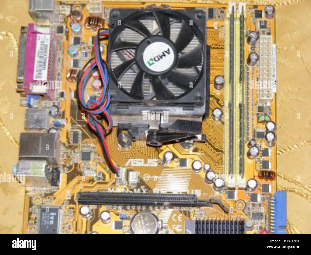 A photograph of the ASUS M2N-MX SE Plus motherboard, focusing on its ...