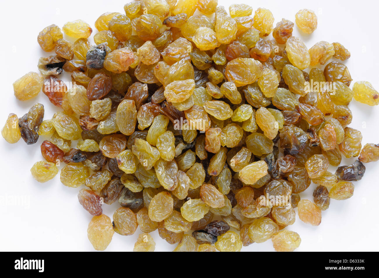 A heap of sweet dry raisin on white background Stock Photo - Alamy