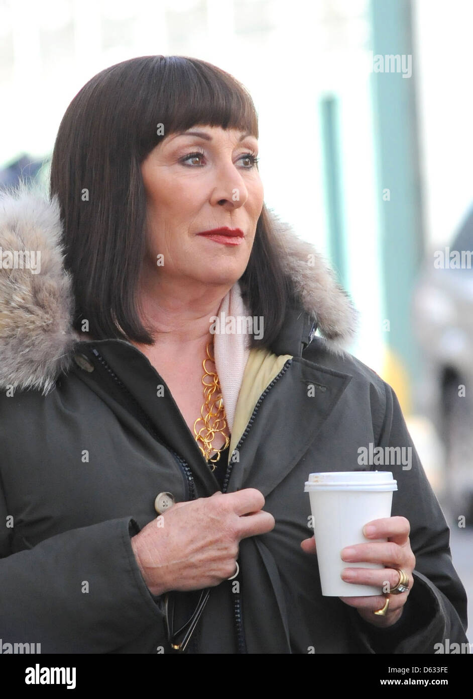 Anjelica Huston braving the cold weather on the set of "Smash" filming ...