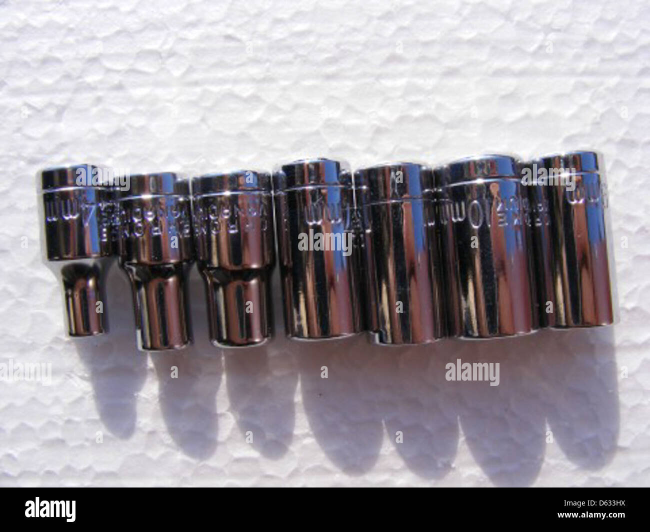 This image shows a socket wrench set, including various sizes of ...