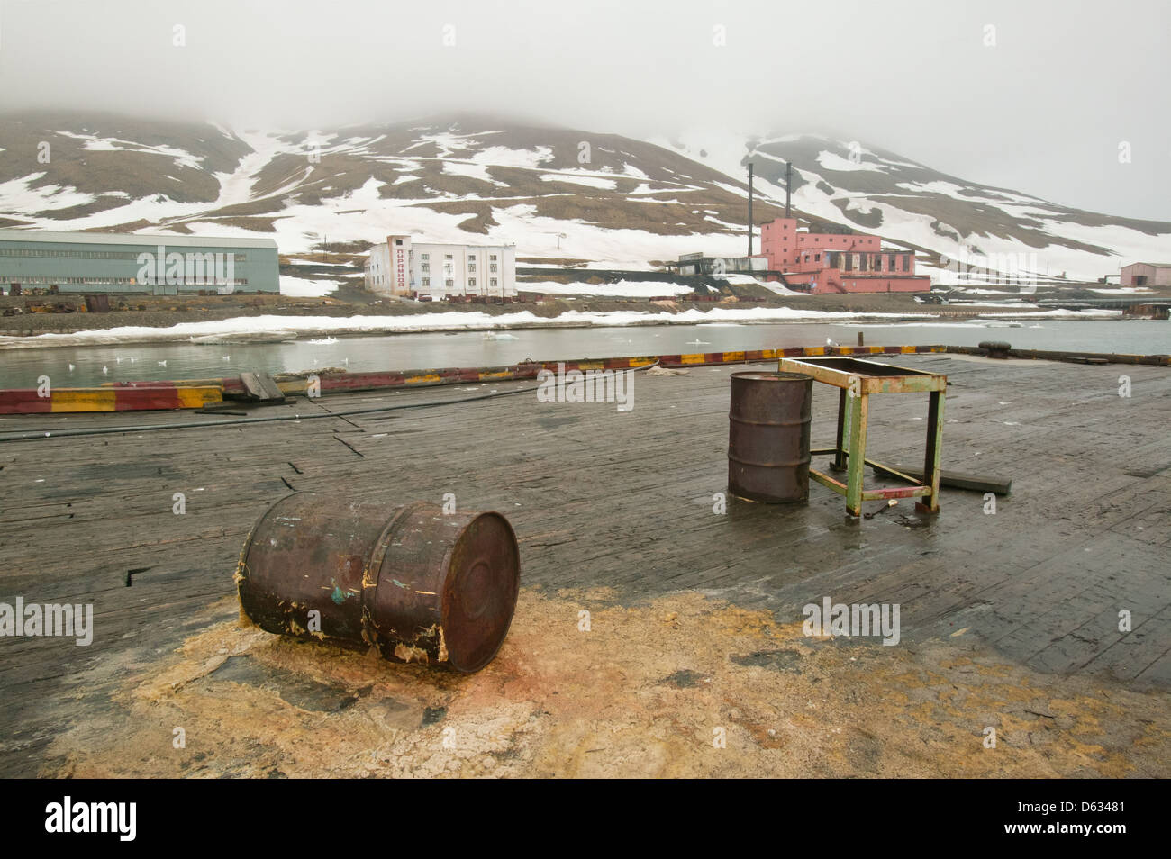 The harbor at the abandoned Russian society Pyramiden, at Spitsbergen ...