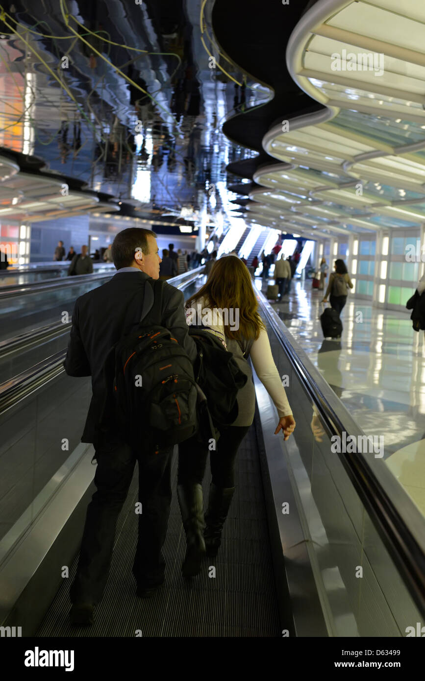 Travelers in the subterranean corridor in Chicago's O'Hare ...