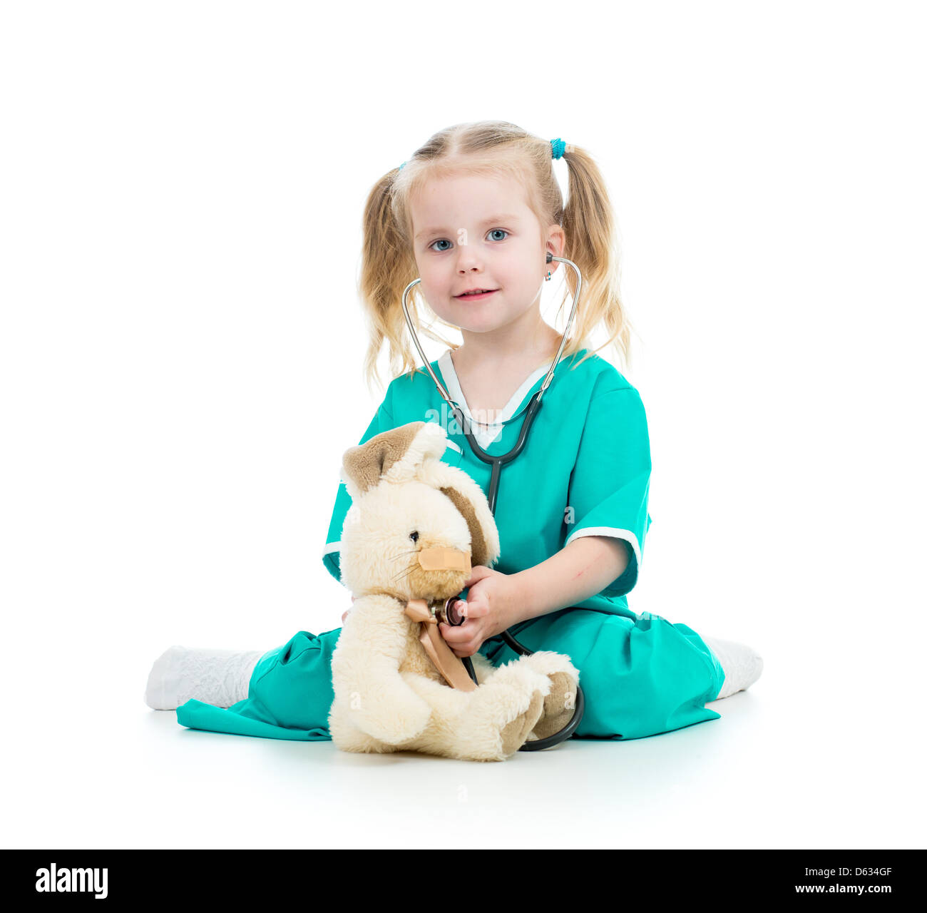 kid playing doctor and examining toy Stock Photo - Alamy