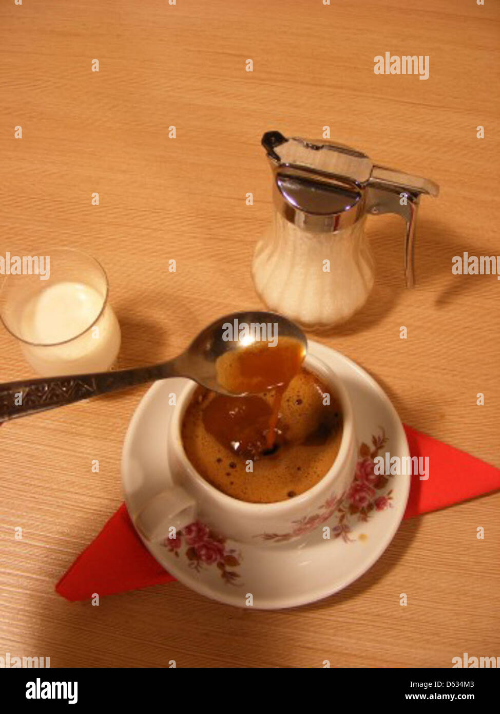 A cup of coffee with milk, featuring rich, dark coffee and smooth milk ...