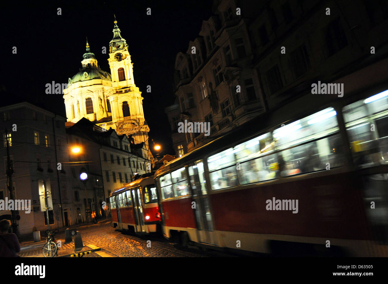 Prague tram running along the Mala Strana at night Stock Photo - Alamy