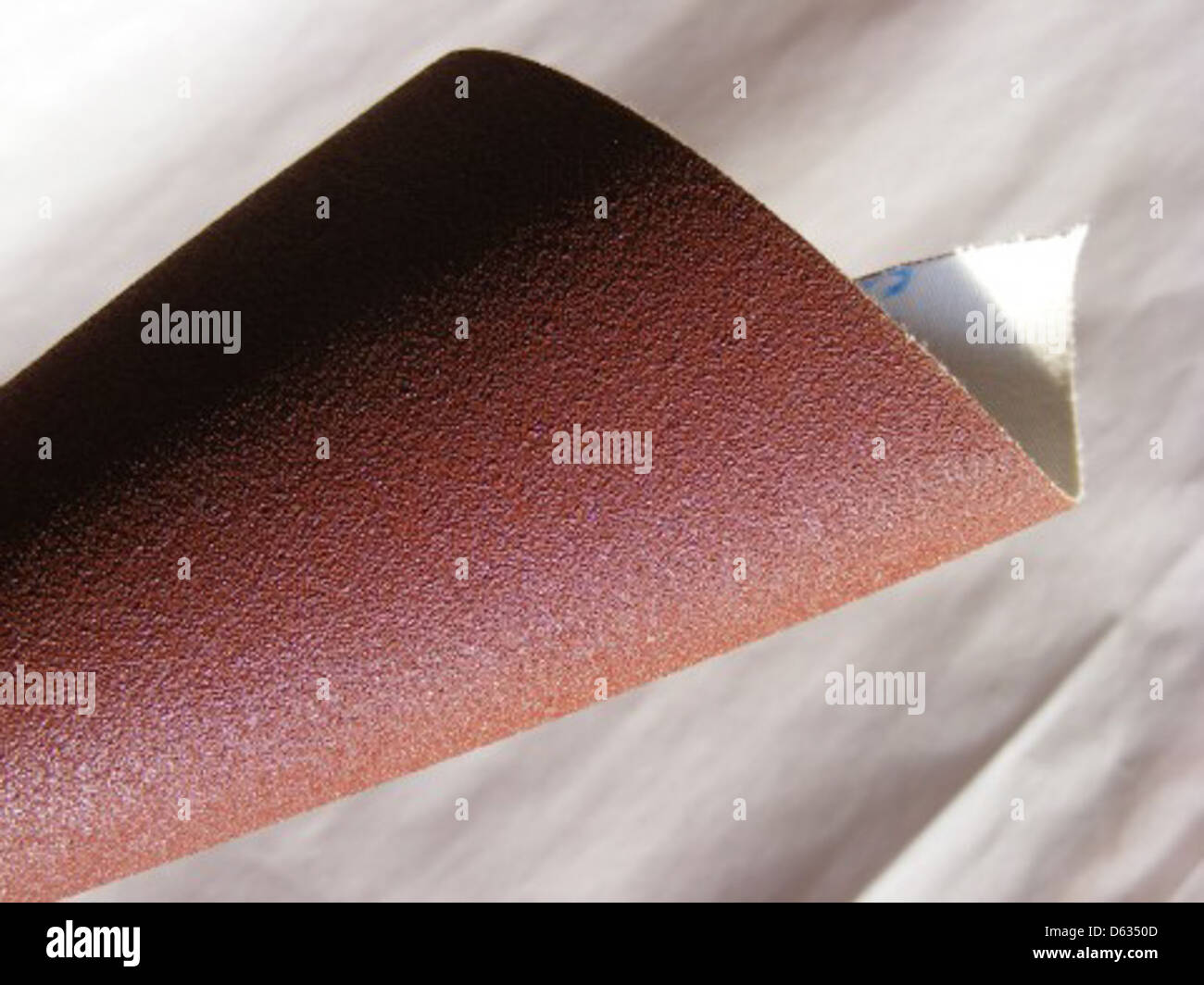 Rough sandpaper is a tool used for smoothing or polishing surfaces by abrasion. It features a ...