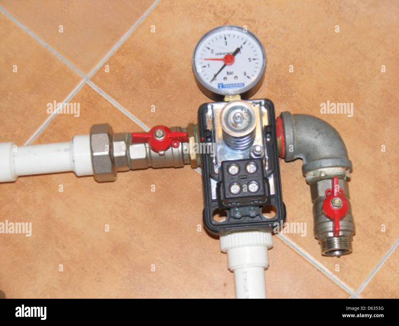 This image shows a dual water supply system with two pipes connected to ...