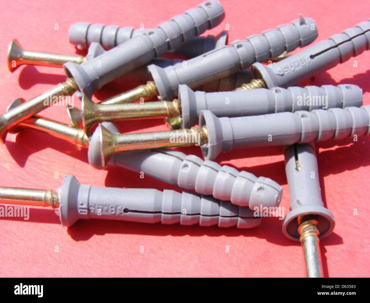 A plastic dowel screw is shown, an essential hardware component for ...