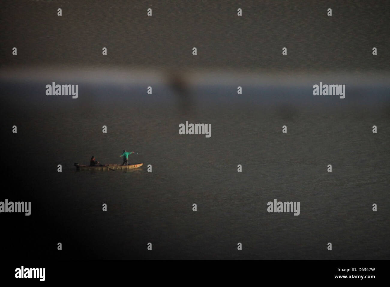 A dynamic image captured from a moving car along the Danube River. The ...