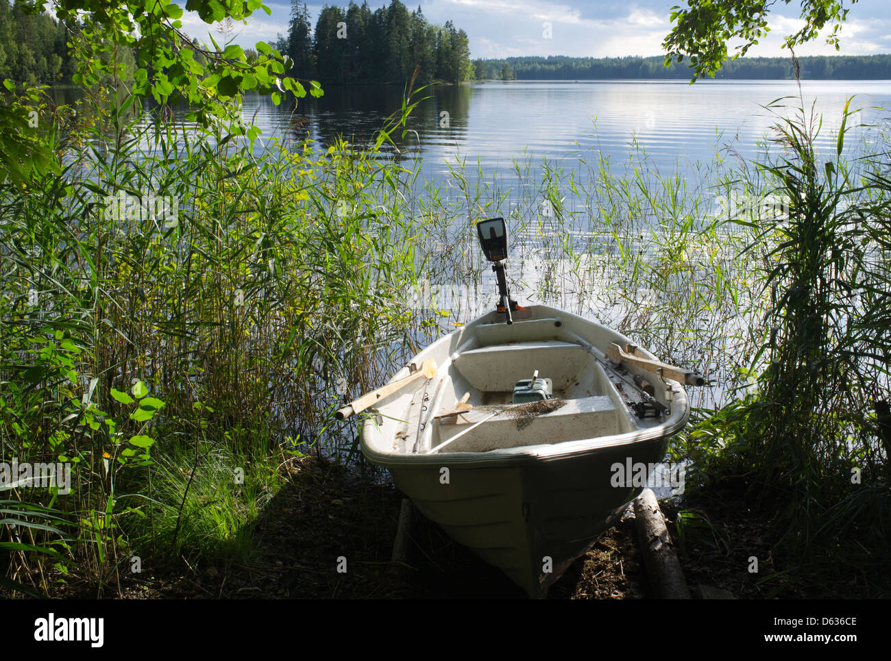 Isolated rowboat / skiff / dinghy with electric outboard engine ...