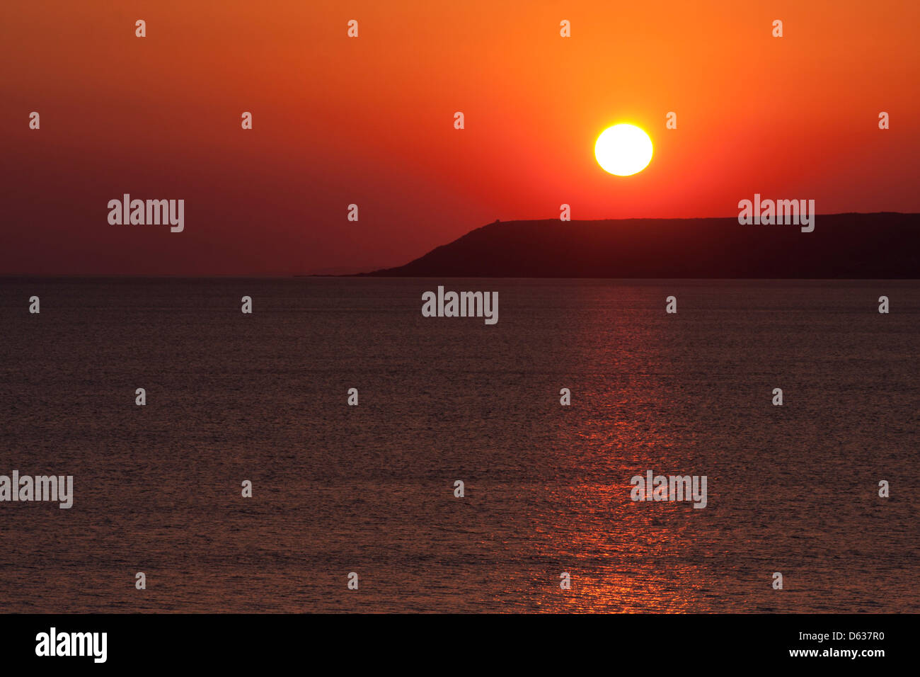 Sunset over the bay at Bigbury in Devon, England, UK Stock Photo - Alamy