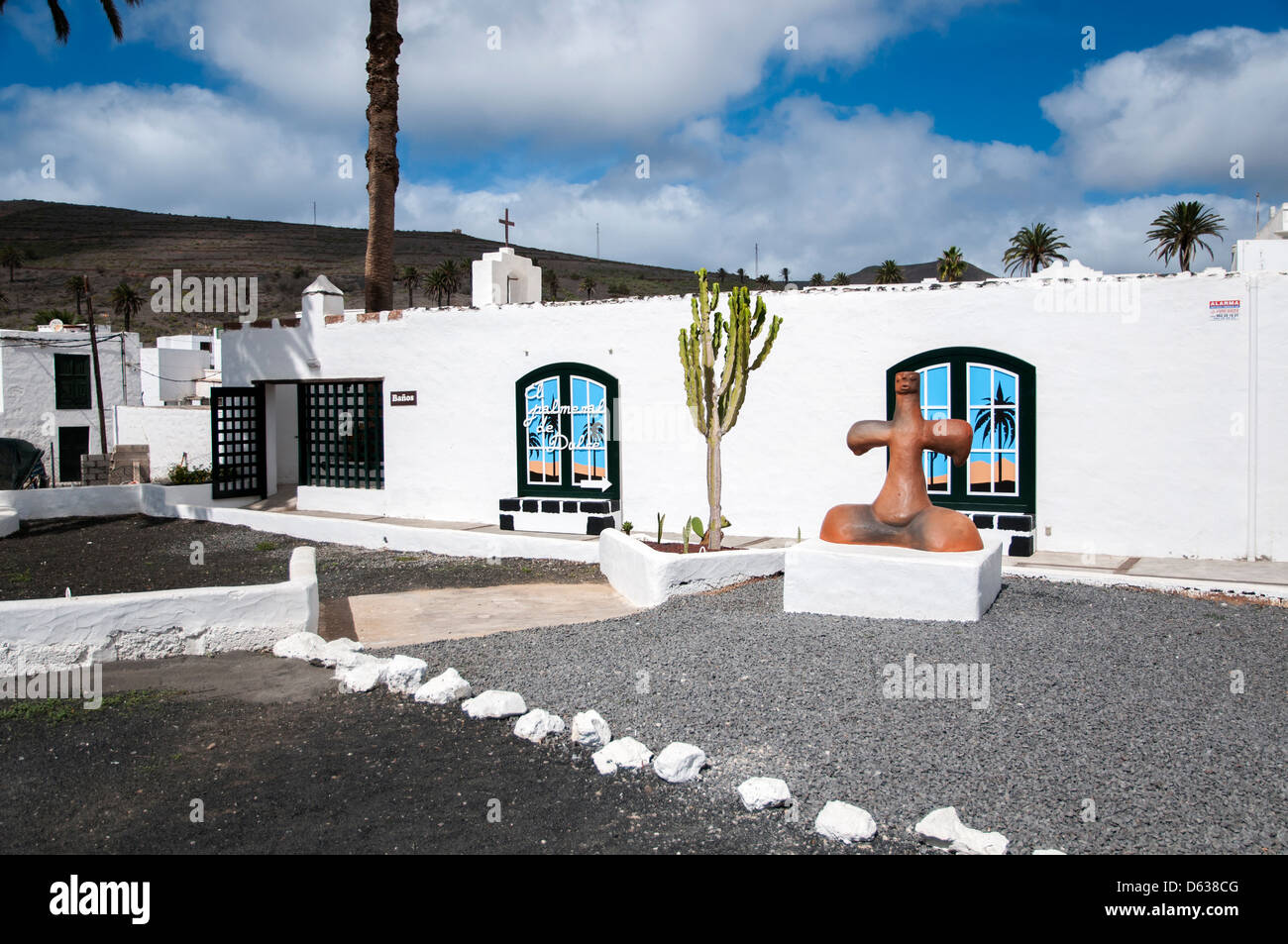 Lanzarote white houses with a small monument Stock Photo - Alamy