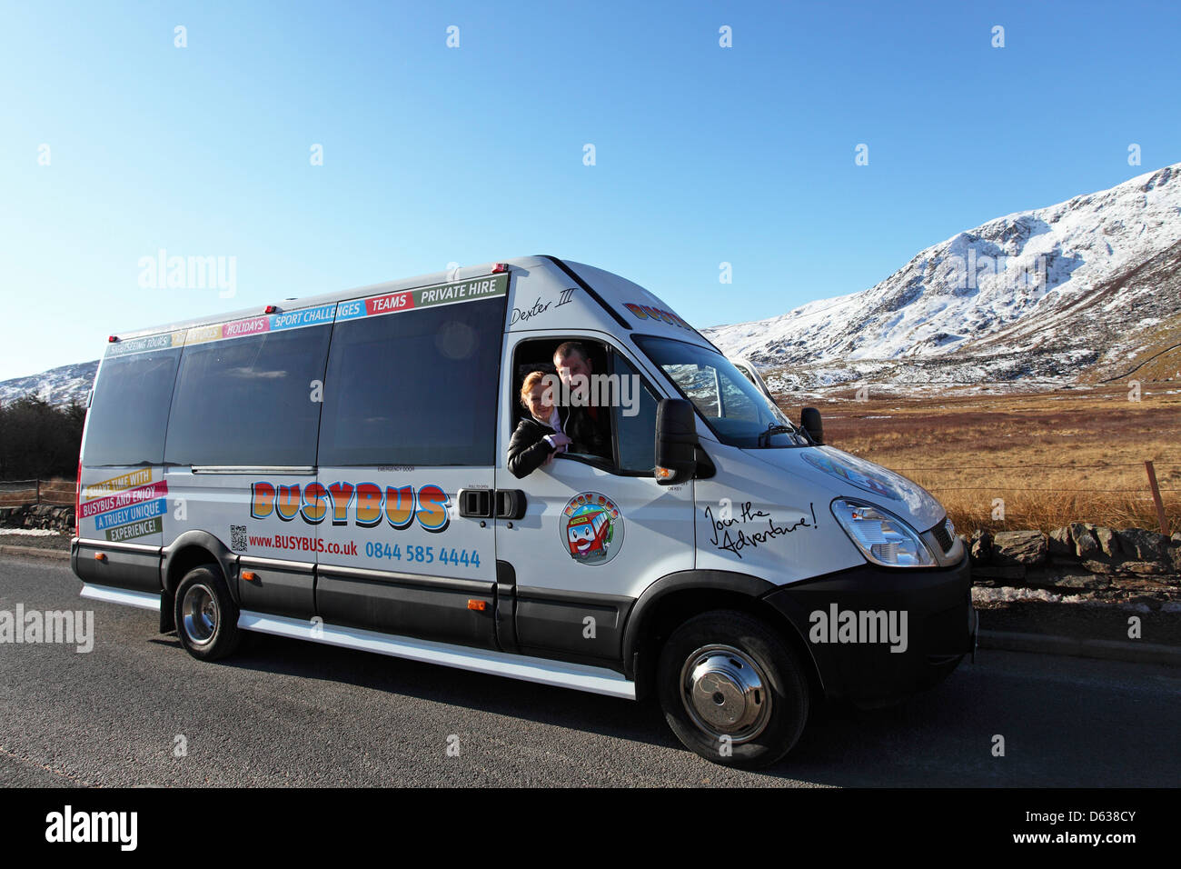 A tour bus runs through Snowdonia National Park, Wales Stock Photo - Alamy