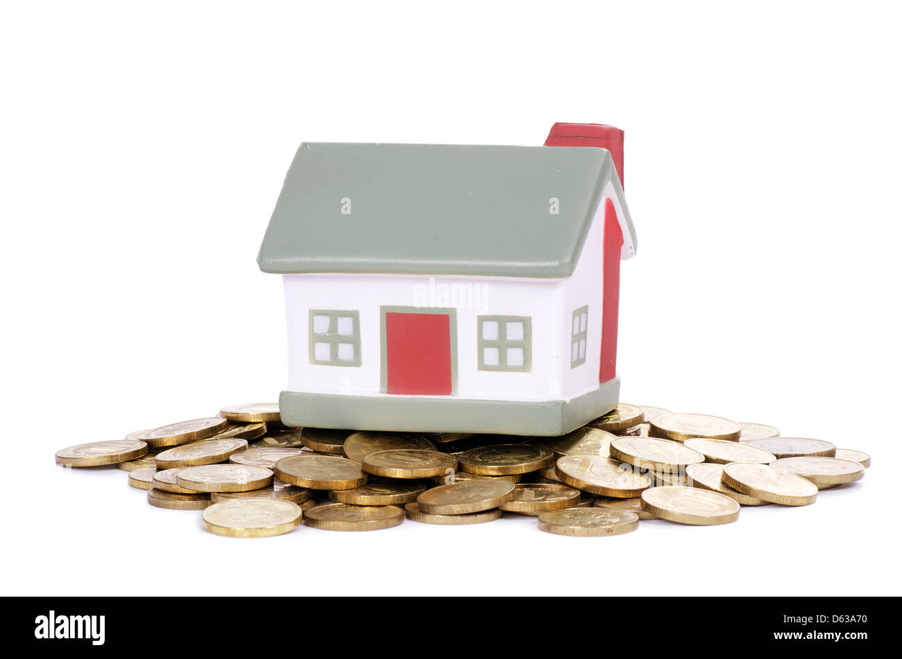 Toy small house and coins Stock Photo - Alamy