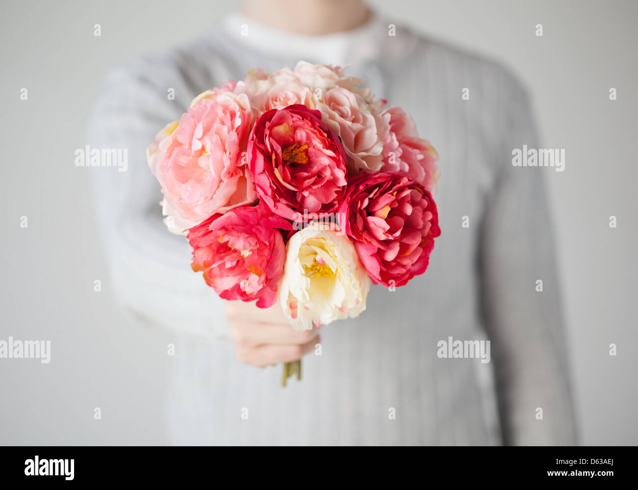 man giving bouquet of flowers Stock Photo - Alamy