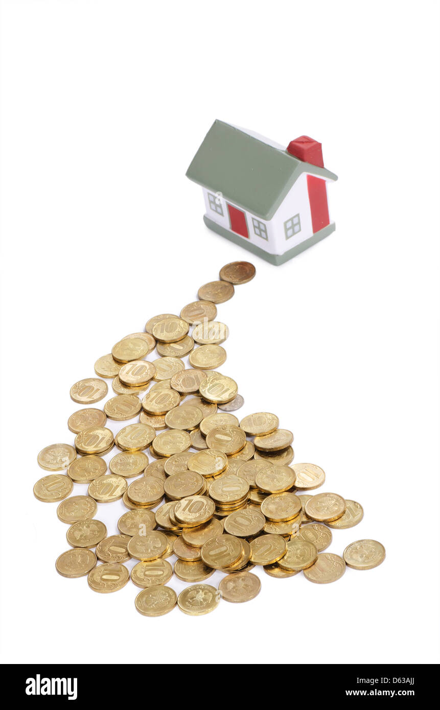 Toy small house and coins Stock Photo - Alamy
