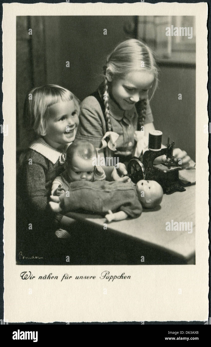 Old German postcard, circa 1938. Girls play in the sewers. Inscription ...