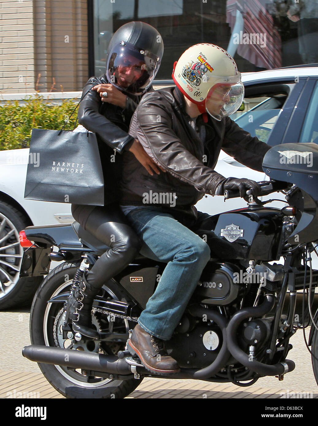 Halle Berry and Olivier Martinez prepare to ride a motorcycle after ...