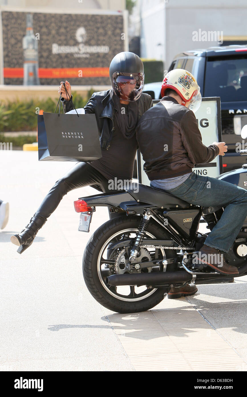 Halle Berry and Olivier Martinez prepare to ride a motorcycle after ...
