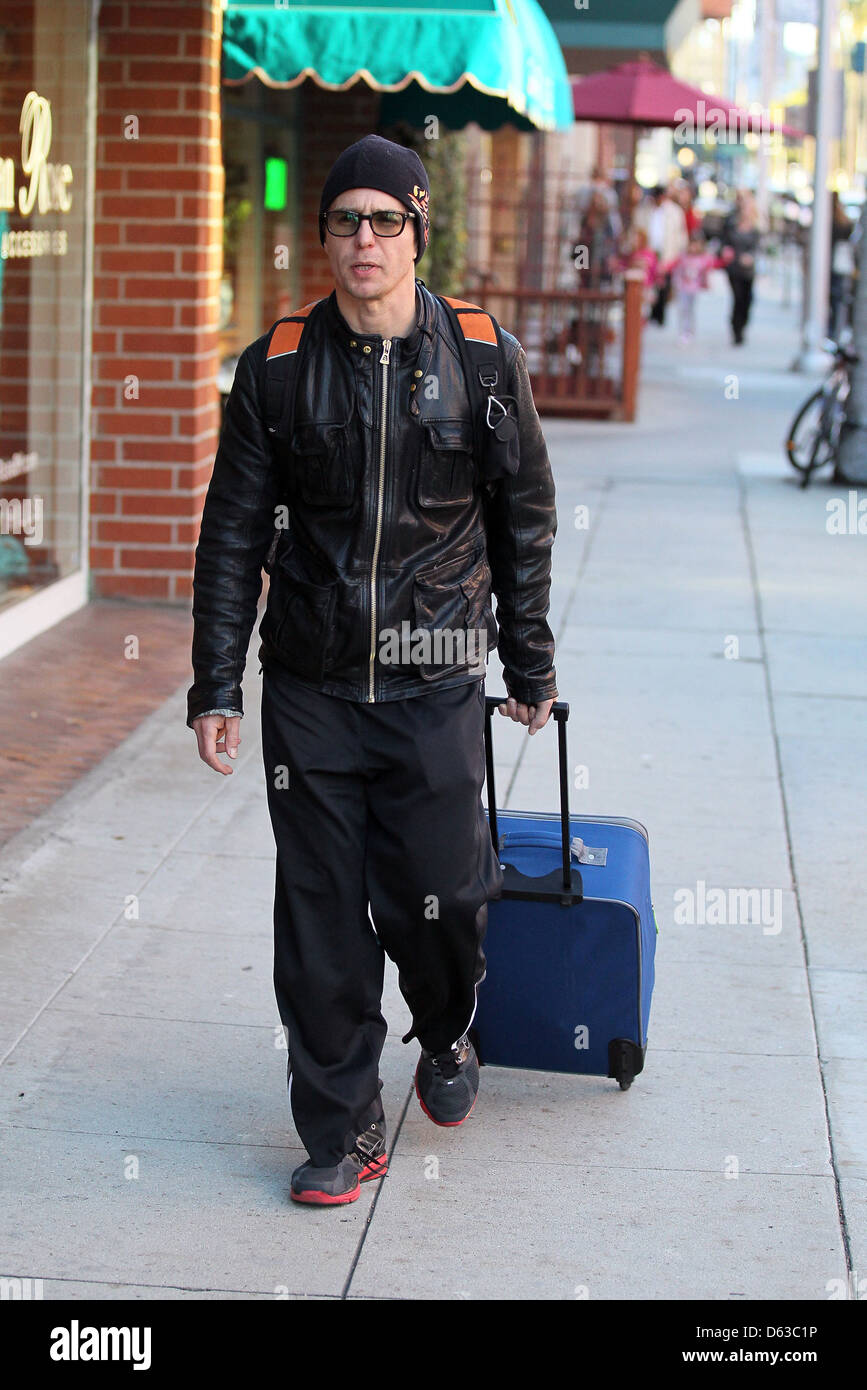 Sam Rockwell out and about in Beverly Hills pulling wheeled luggage Los ...